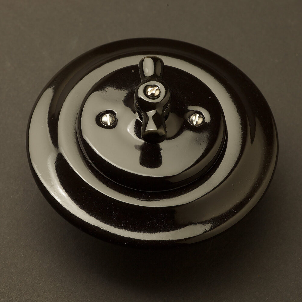 Black Porcelain single turn light switch with mount plate